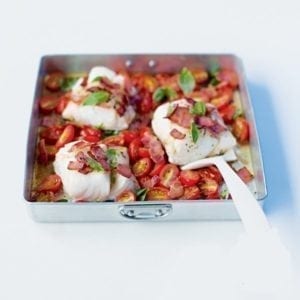 Roast cod with bacon, tomatoes and basil recipe | delicious. magazine