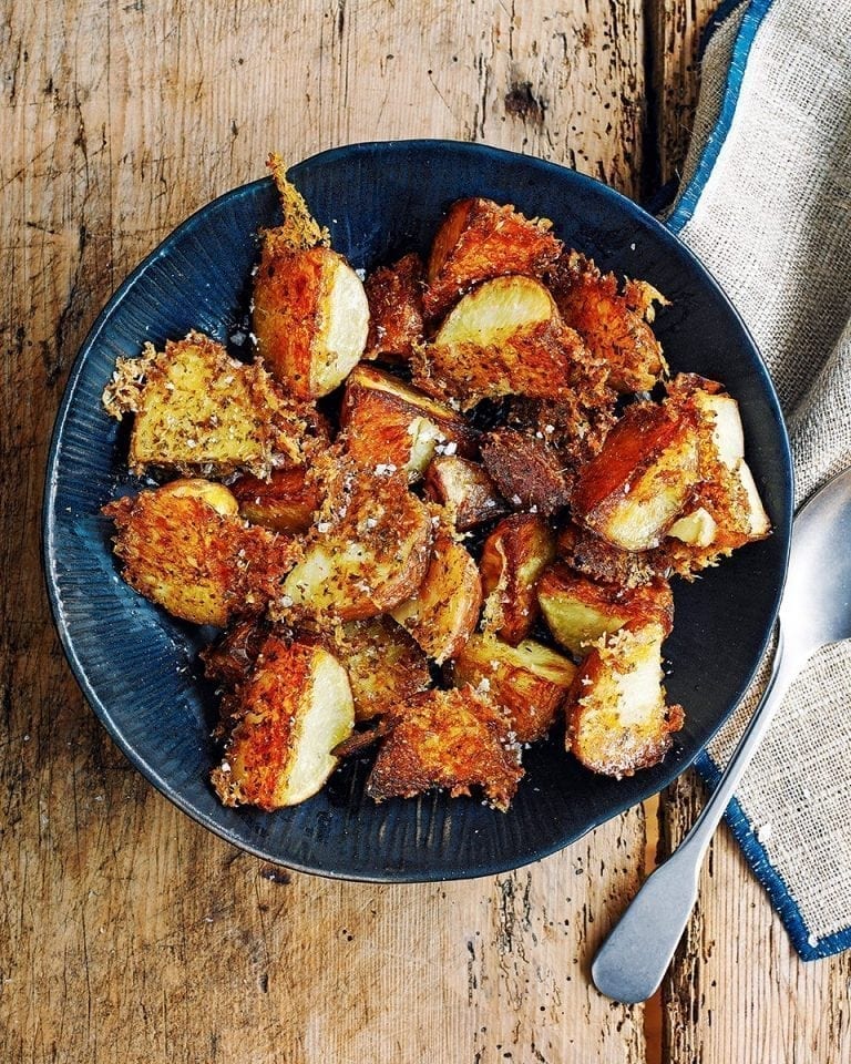 Crispy parmesan and oregano roasties recipe | delicious. magazine