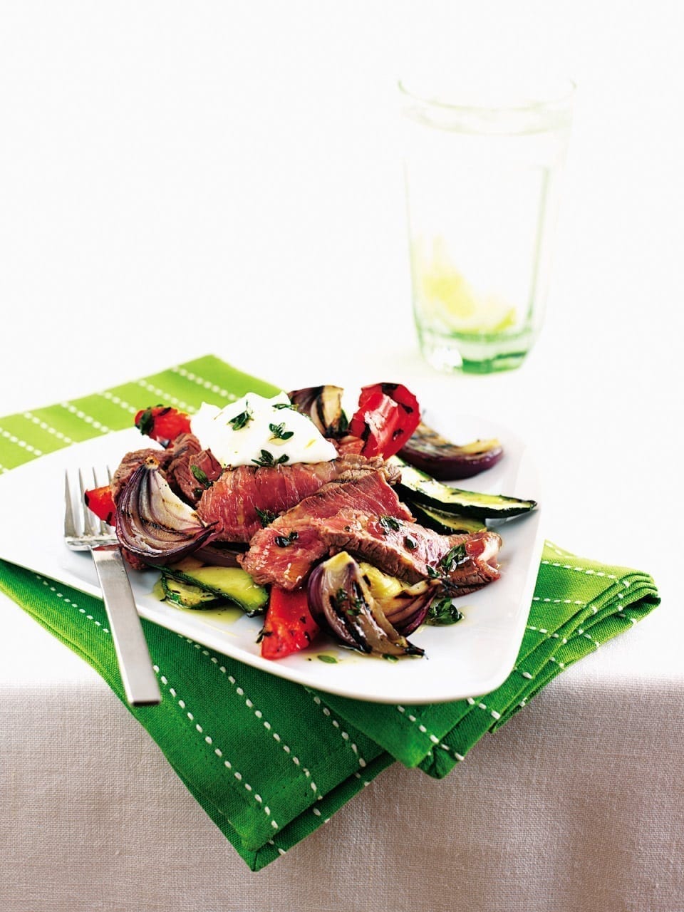 Seared steak on Mediterranean vegetables recipe | delicious. magazine