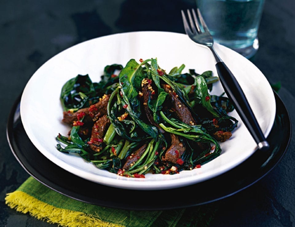 Stir-fried garlic chilli beef and ong choi recipe | delicious. magazine